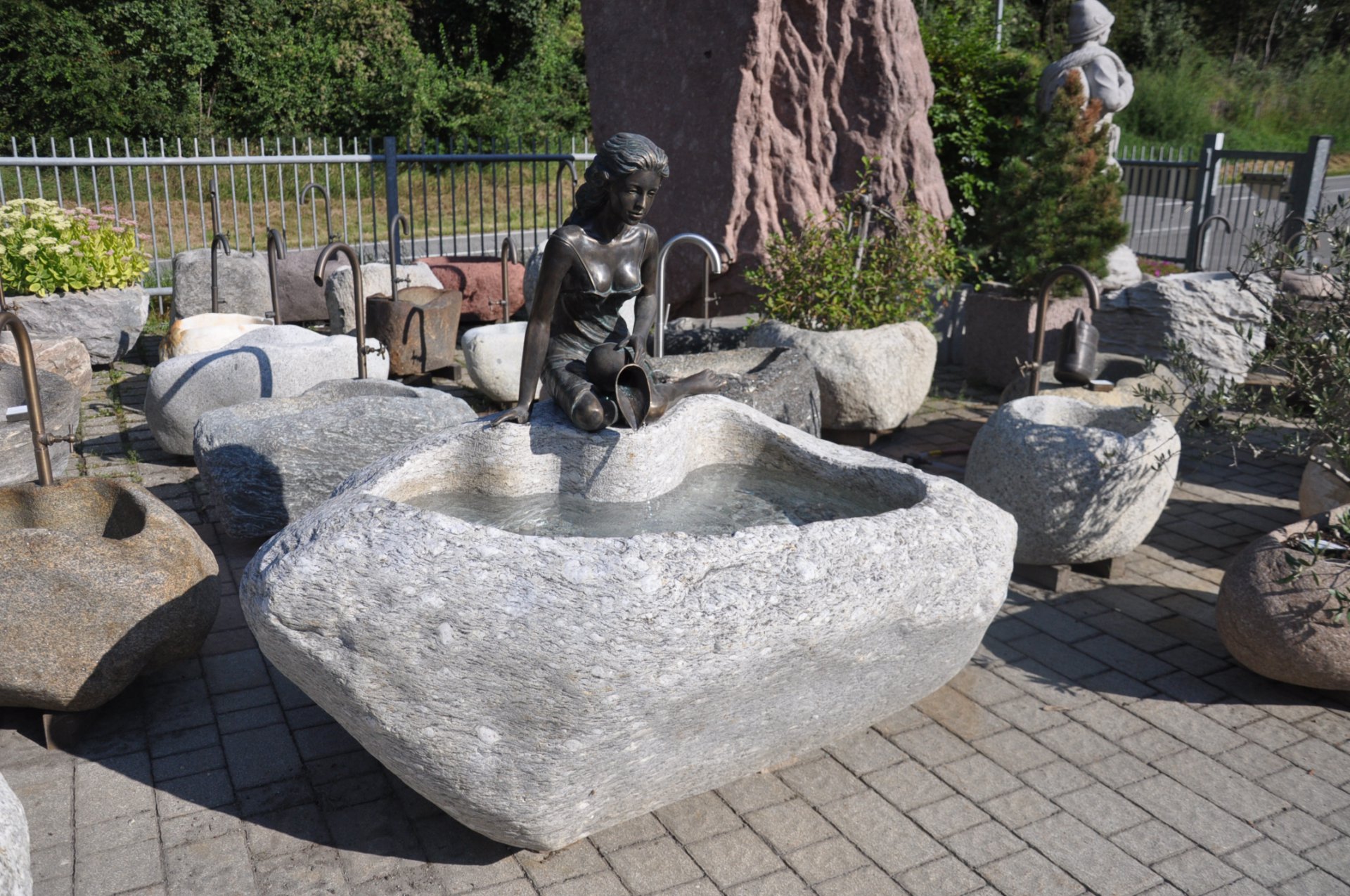 Tonalite fountain with bronze figure Elonie