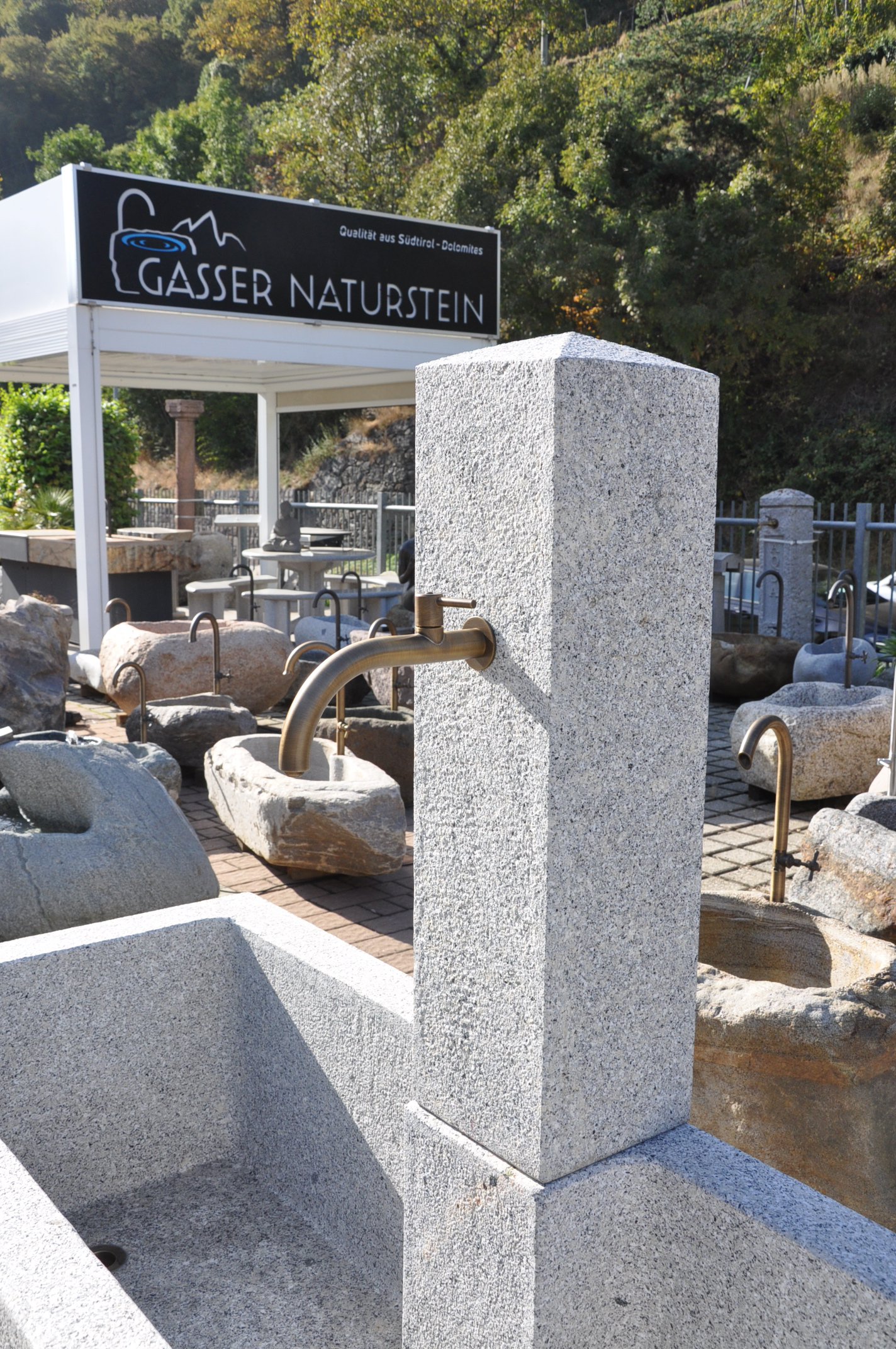 Large rectangular granite trough with faucet