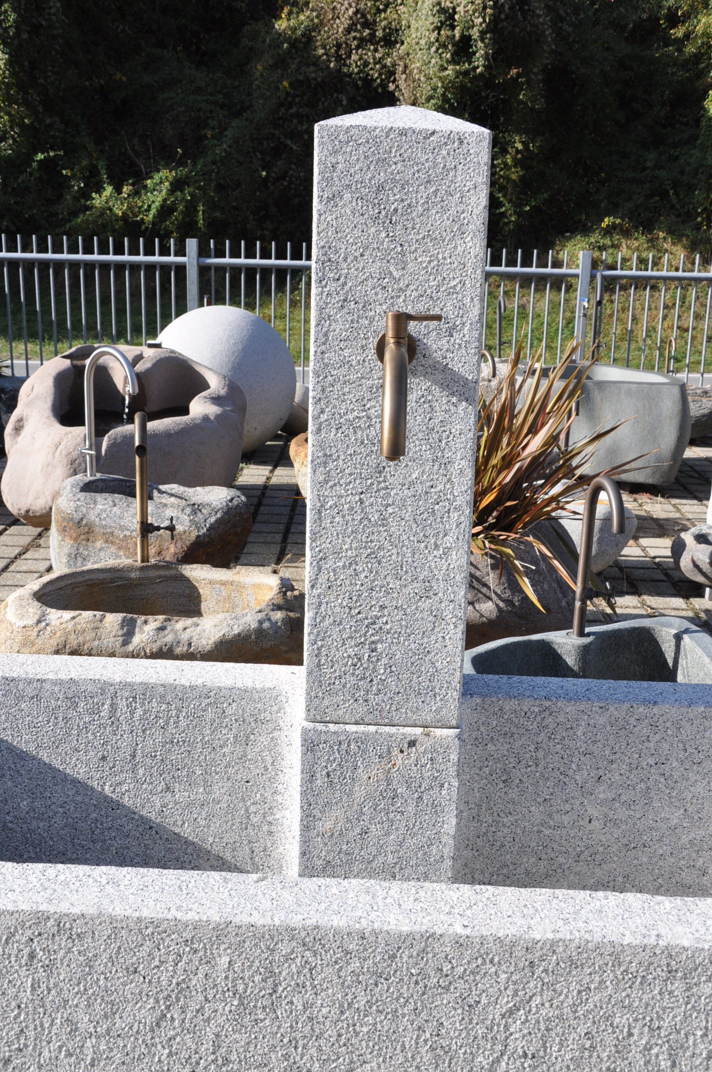 Large rectangular granite trough with faucet