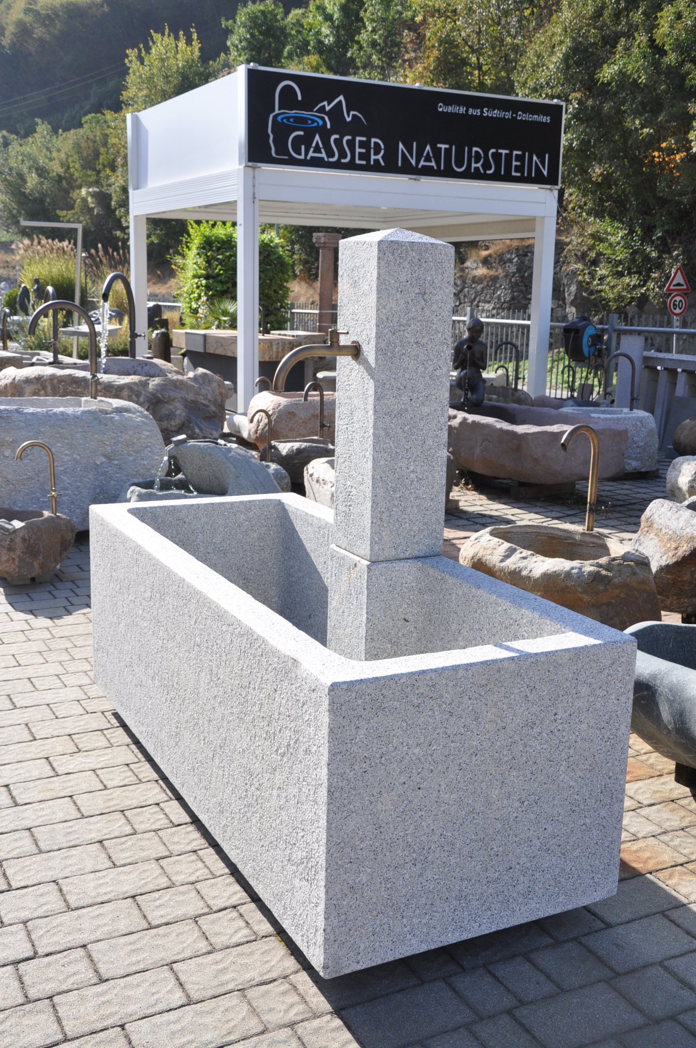Large rectangular granite trough with faucet