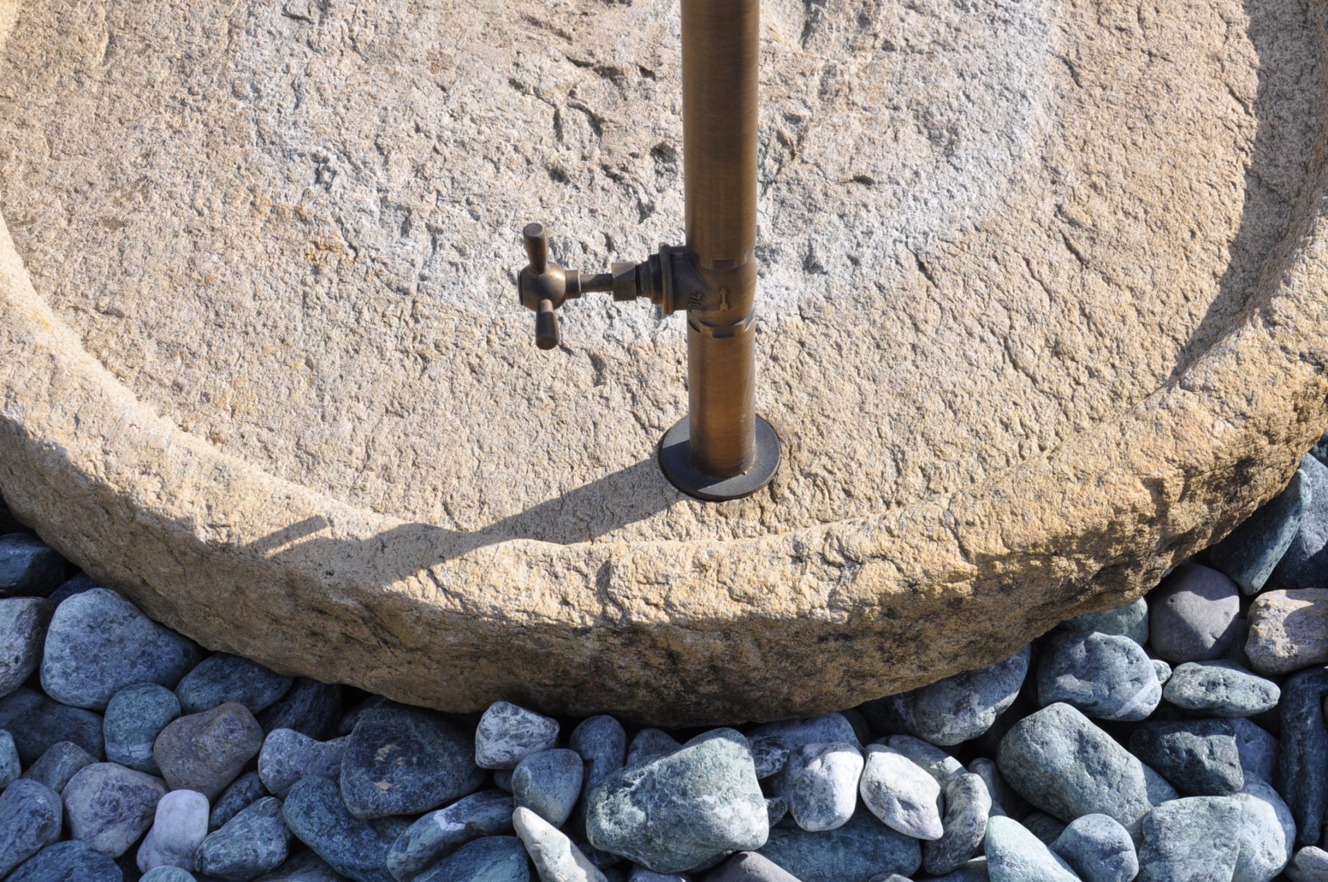 Millstone converted to a spring stone with tap